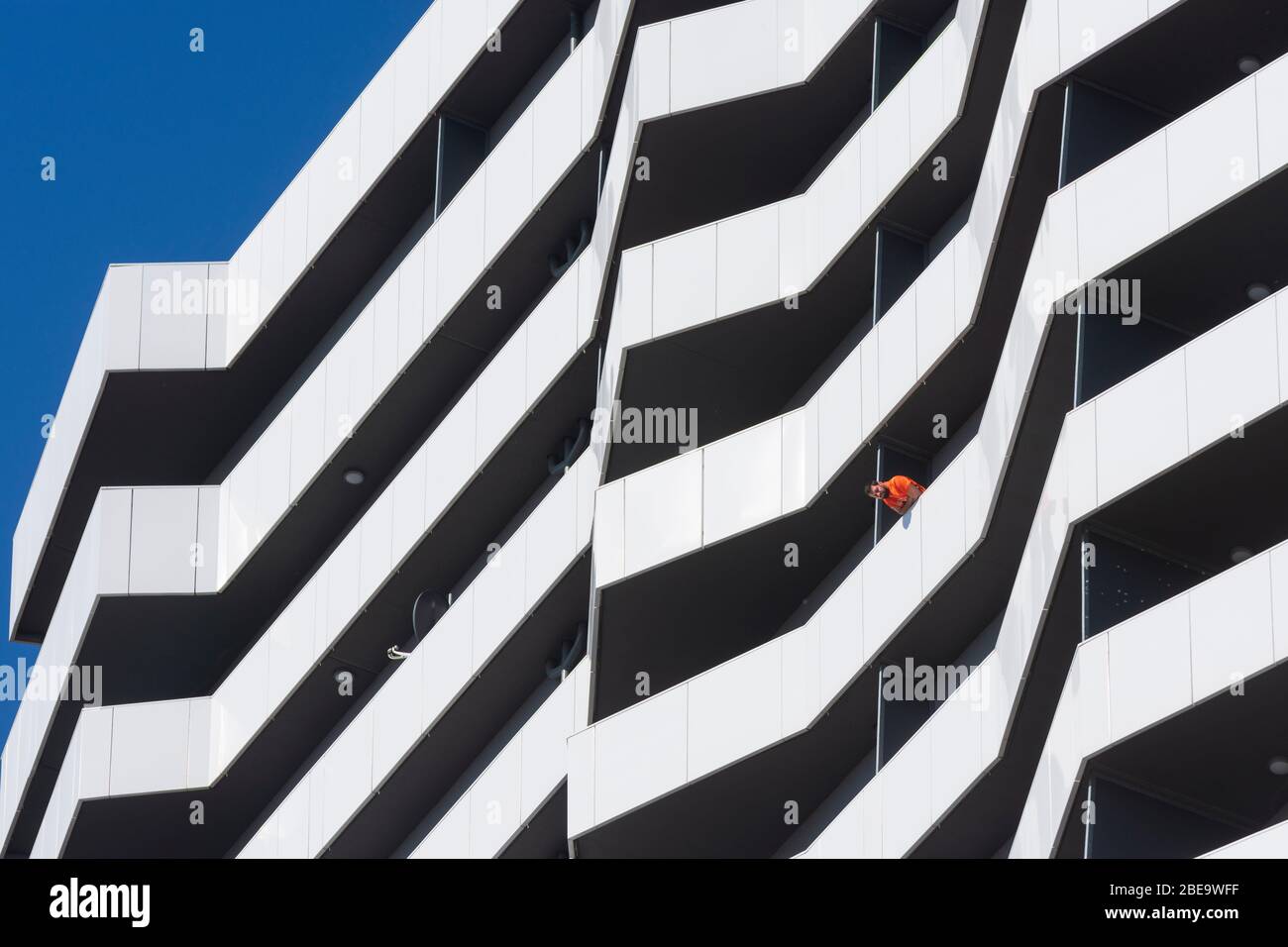 Wien, Vienna: continuous balconies detail, simple structure, man at ...