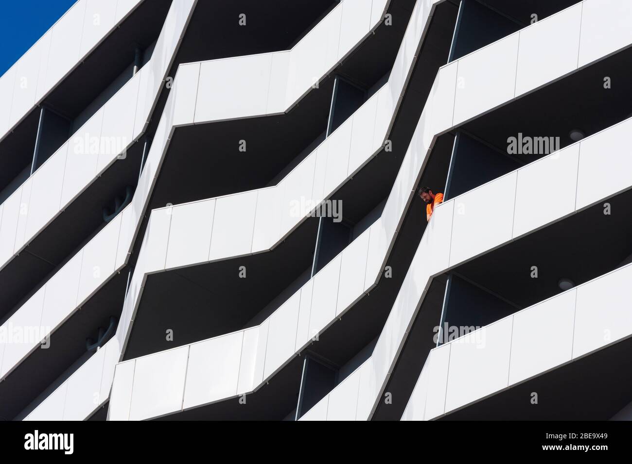 Wien, Vienna: continuous balconies detail, simple structure, man at ...