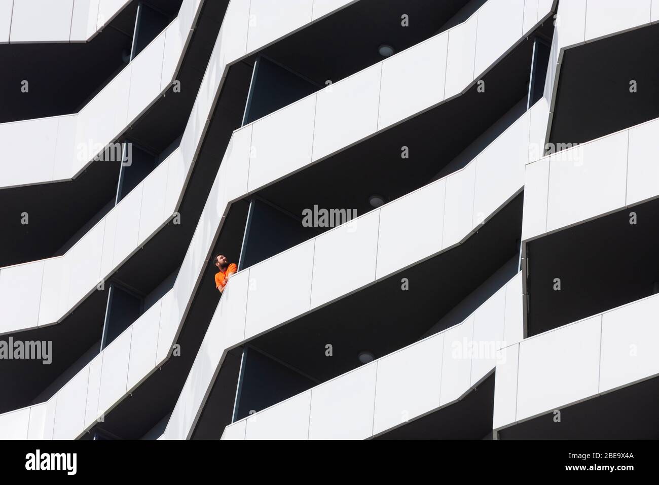 Wien, Vienna: continuous balconies detail, simple structure, man at ...