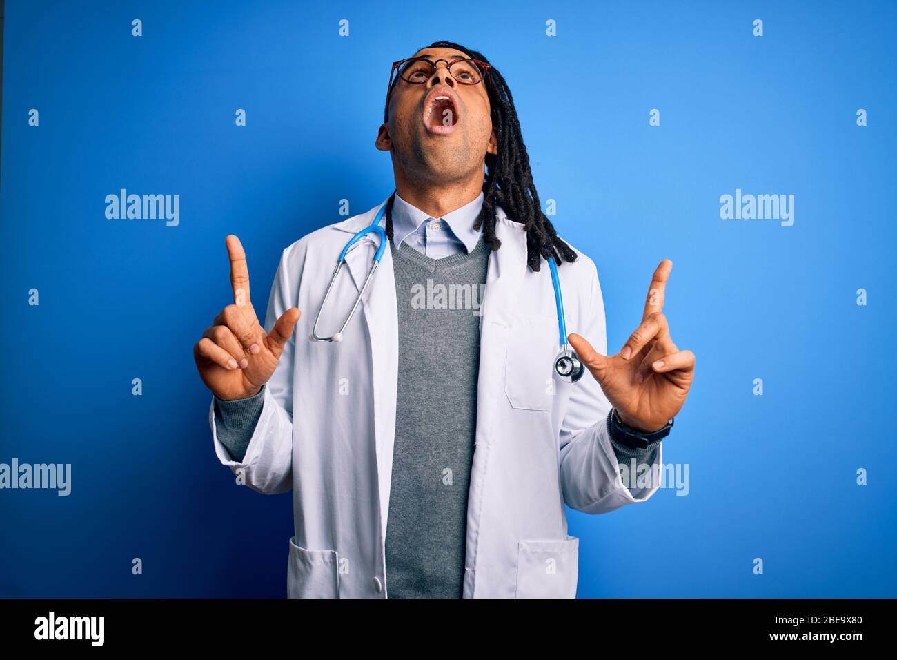 Young african american doctor man with dreadlocks wearing stethoscope ...