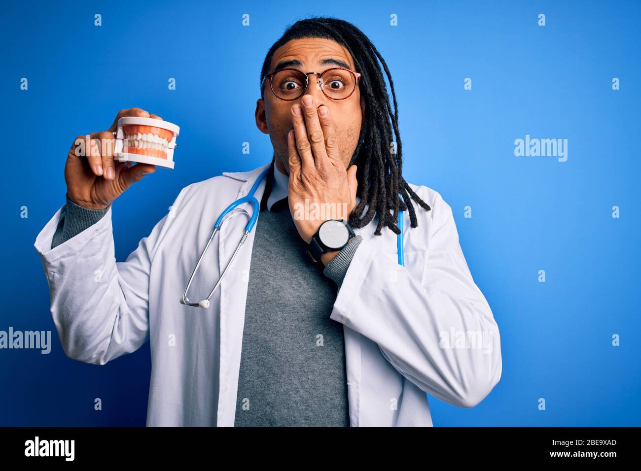 Young african american afro dentist doctor man wearing stethoscope ...