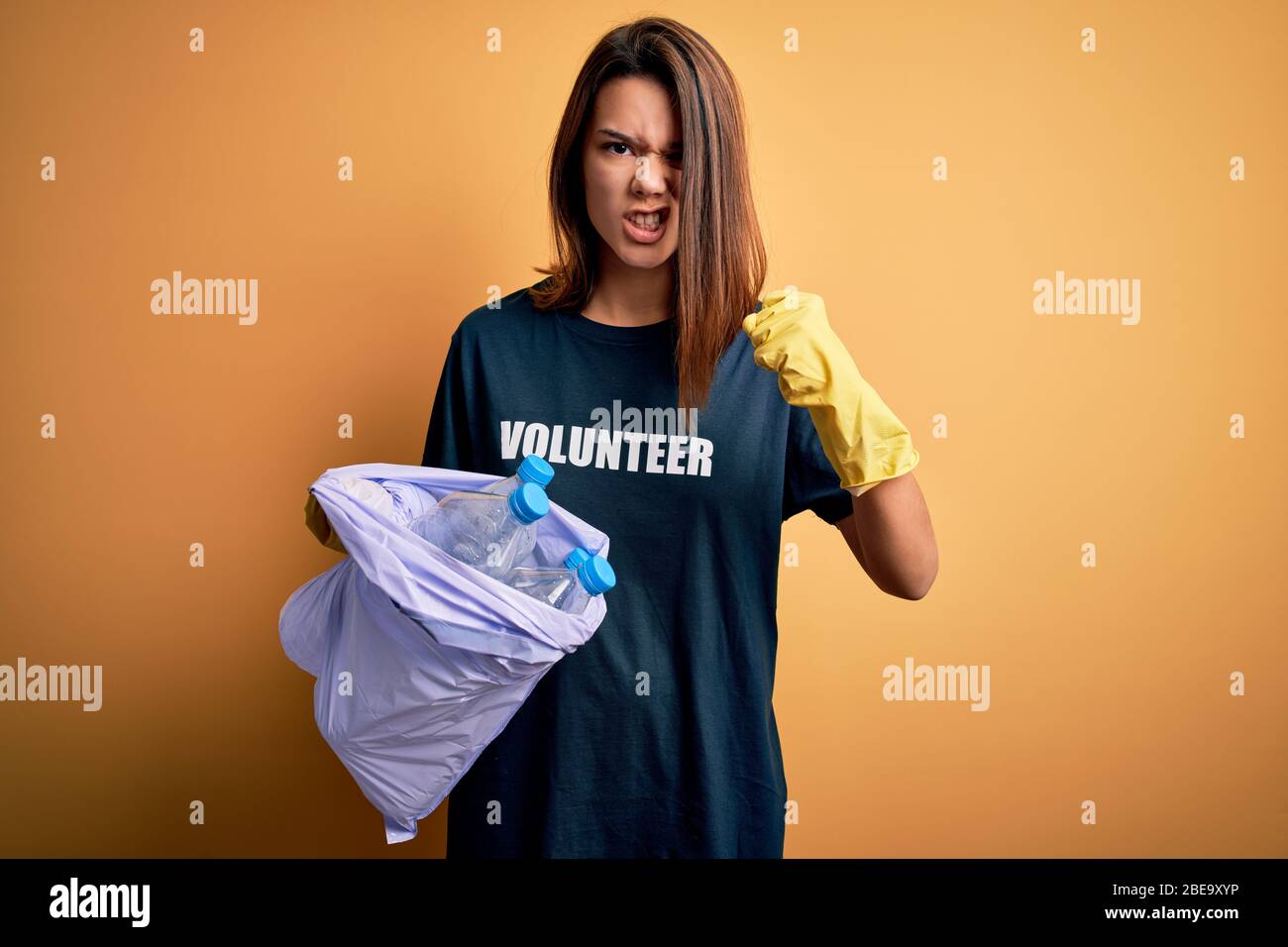 Beautiful volunteer girl caring environment doing volunteering holding ...