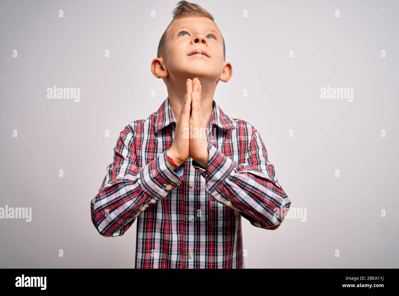 Young little caucasian kid with blue eyes wearing elegant shirt ...