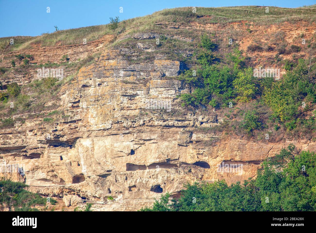 natural caves in the cliff Stock Photo - Alamy