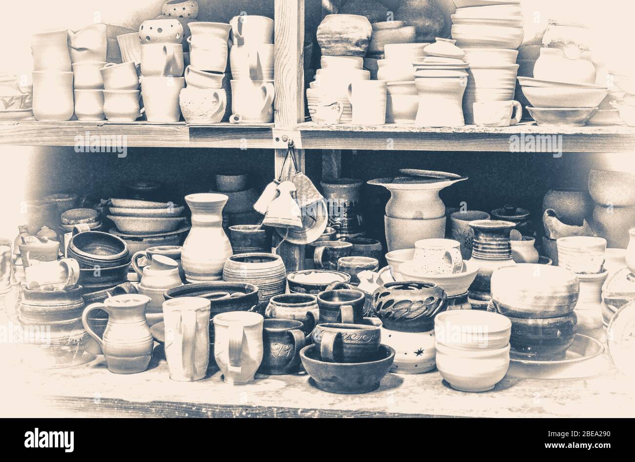 Old vintage photo.many different pottery standing on the shelves in a ...