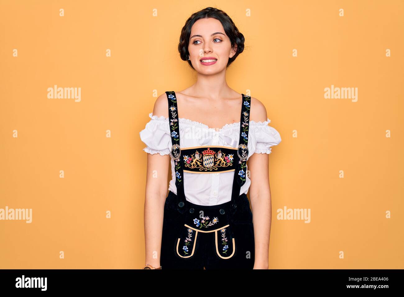 Young beautiful german woman with blue eyes wearing traditional ...