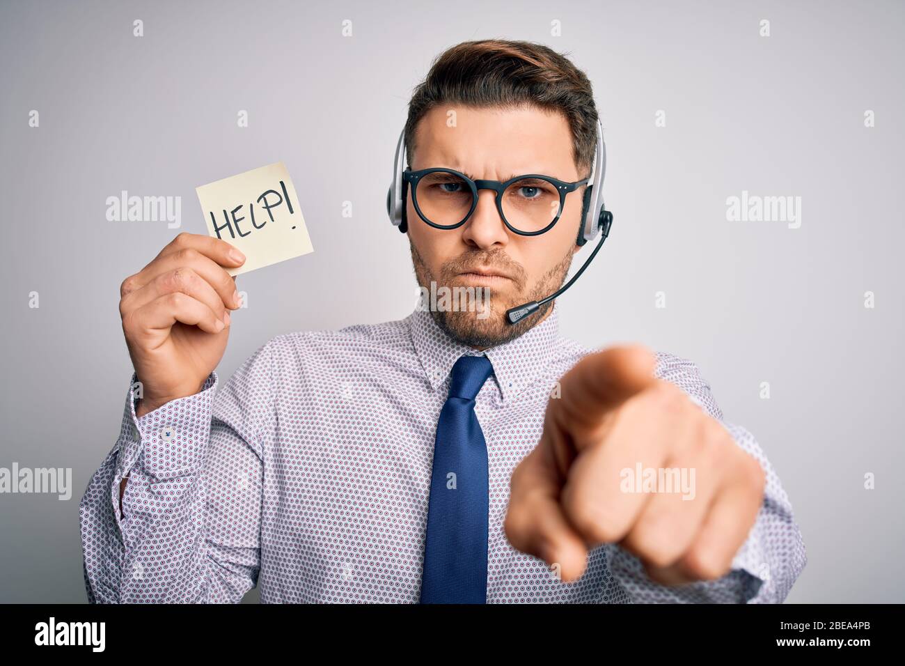 Young call center operator business man with blue eyes offering support ...