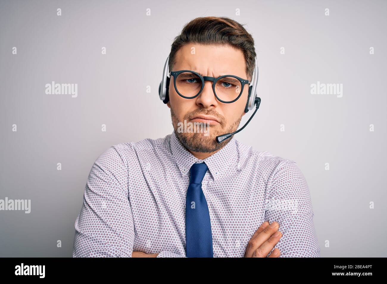 Young call center operator business man with blue eyes wearing glasses ...