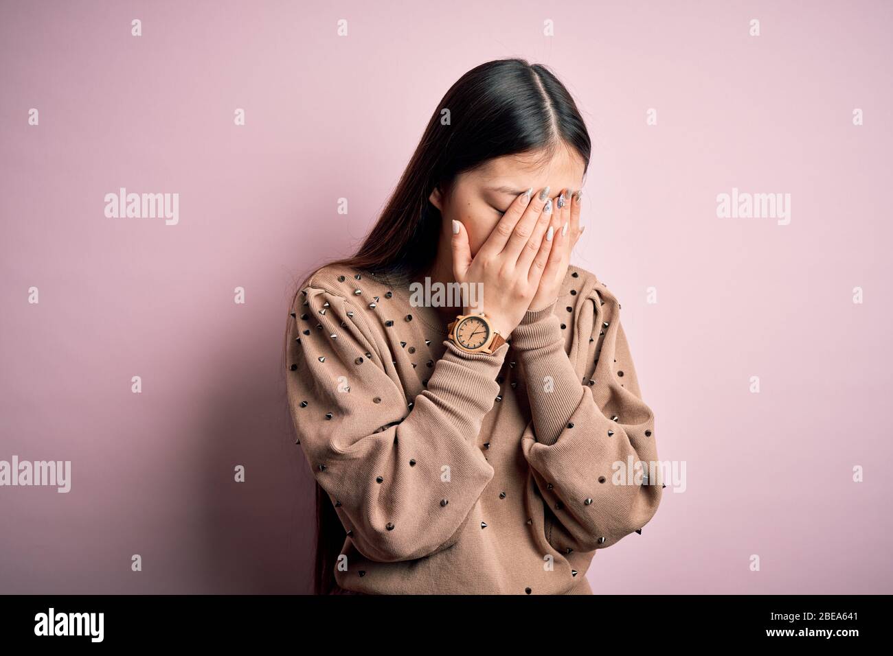 Young beautiful asian woman wearing fashion and elegant sweater over ...