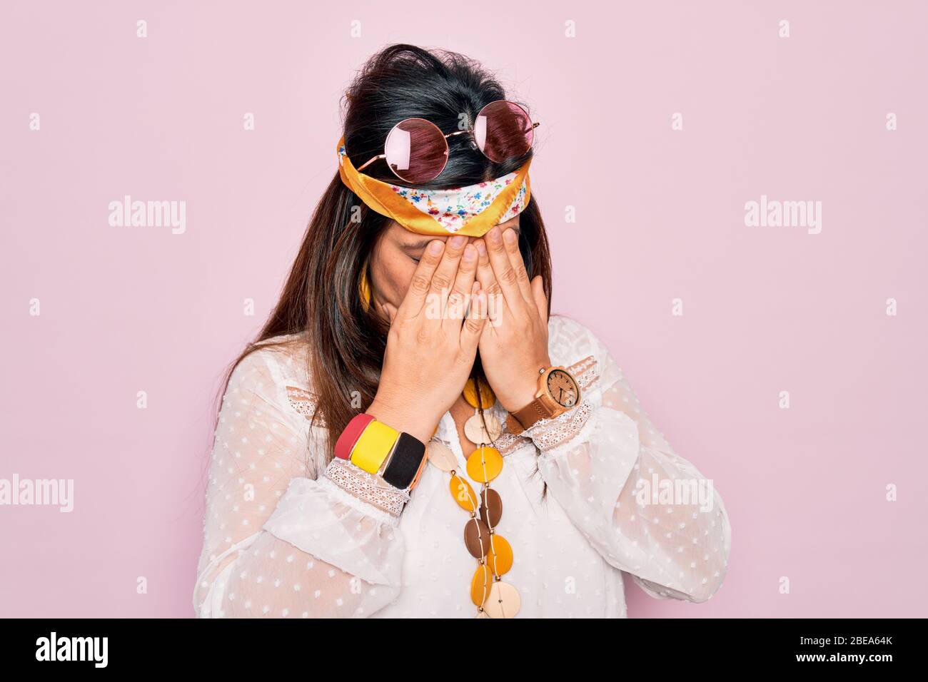 Young hispanic hippie woman wearing fashion boho style and sunglasses ...