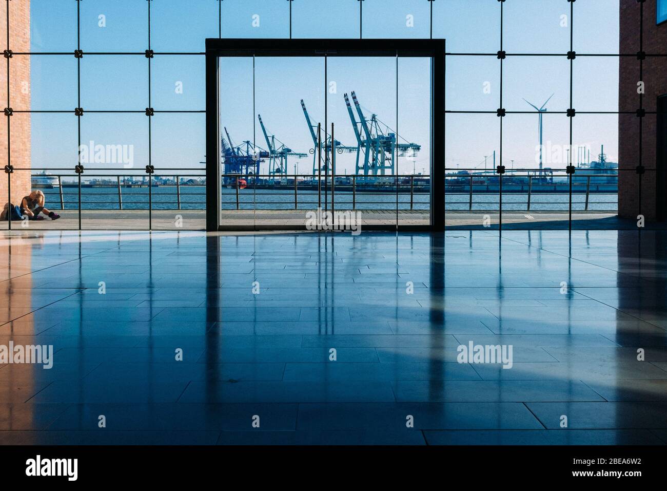 Hamburg port through the office building glass wall Stock Photo - Alamy