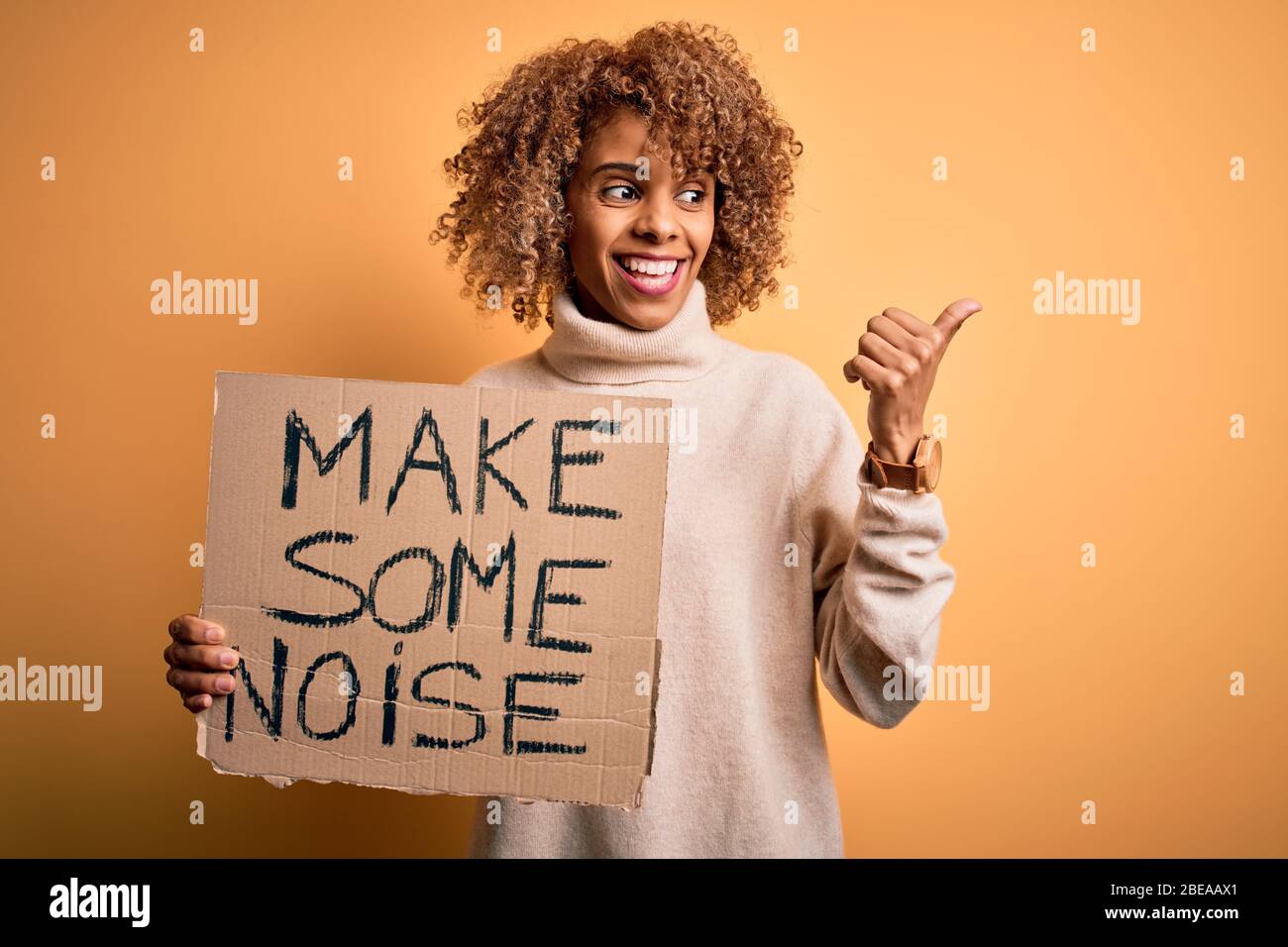 African american activist woman asking for revolution holding banner ...