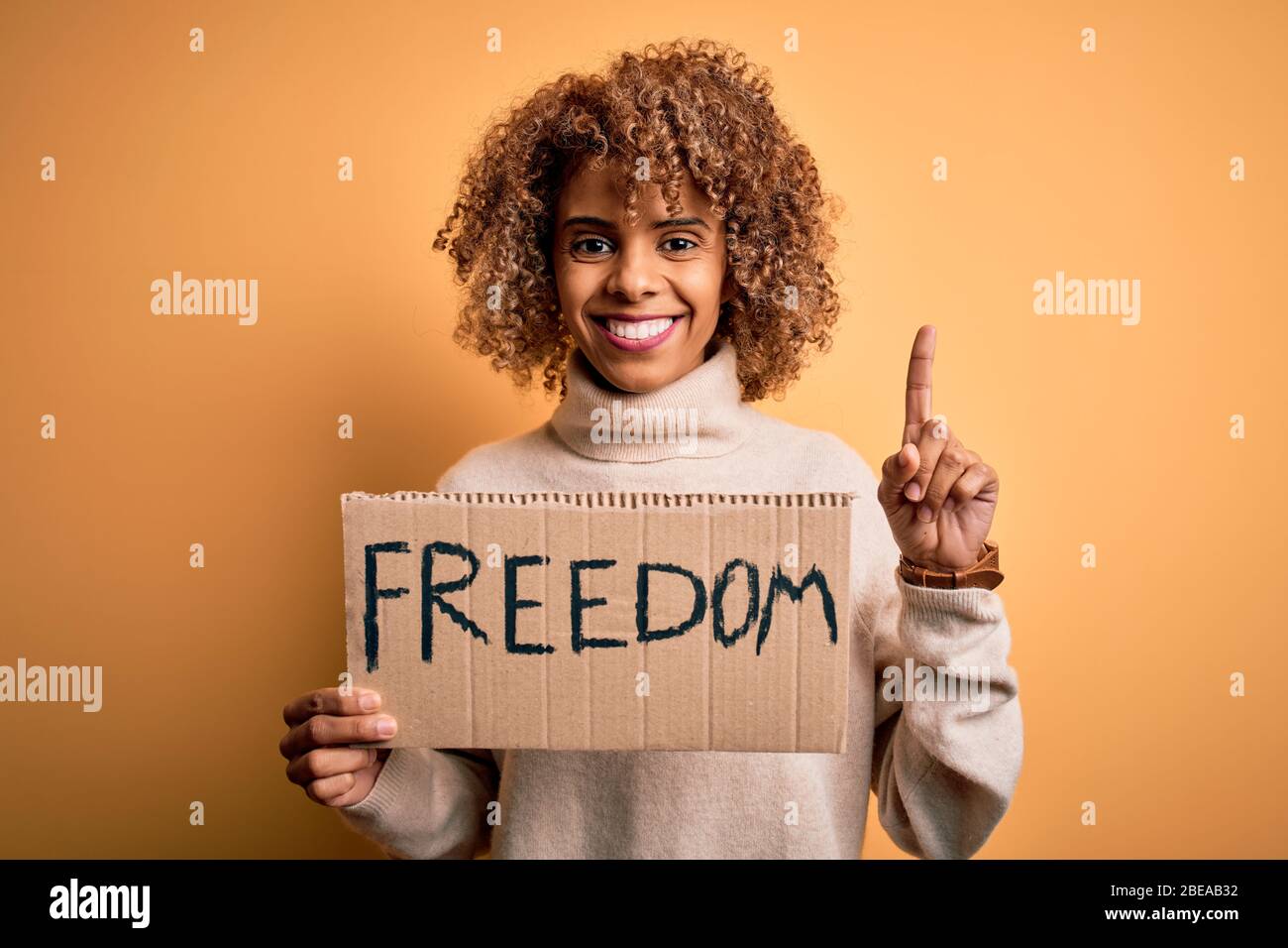 African american activist woman asking for liberty holding banner with ...