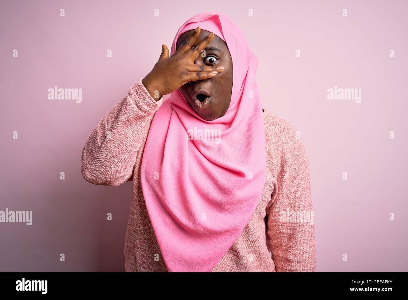 Young african american plus size woman wearing muslim hijab over ...