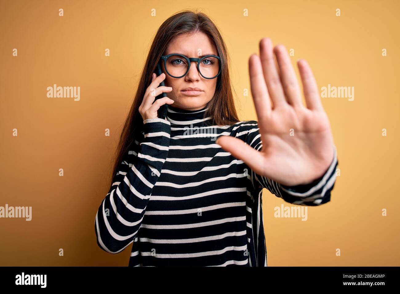 Young beautiful woman with blue eyes having conversation talking on the ...