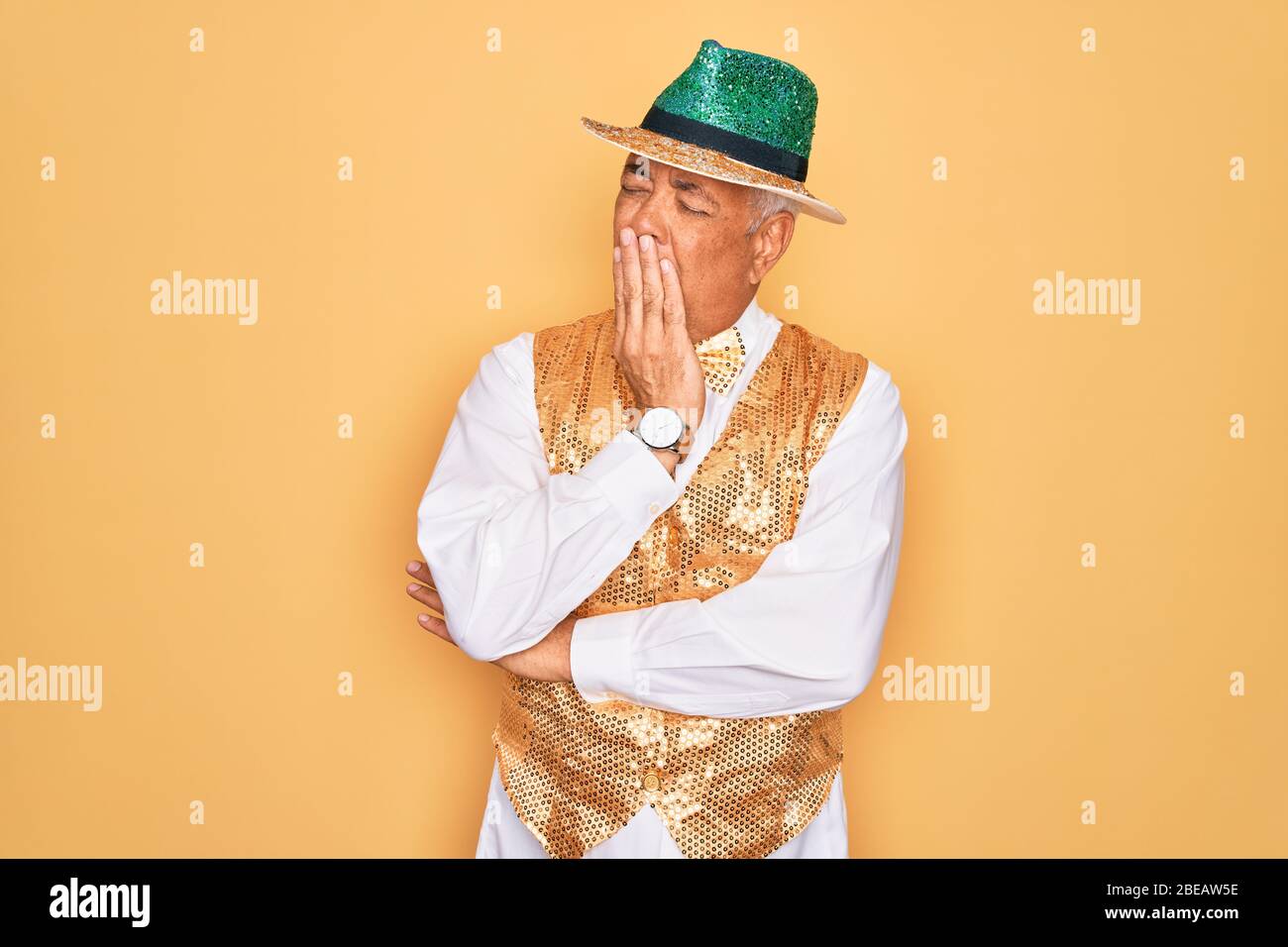 Middle age senior grey-haired man wearing Brazilian carnival custome ...