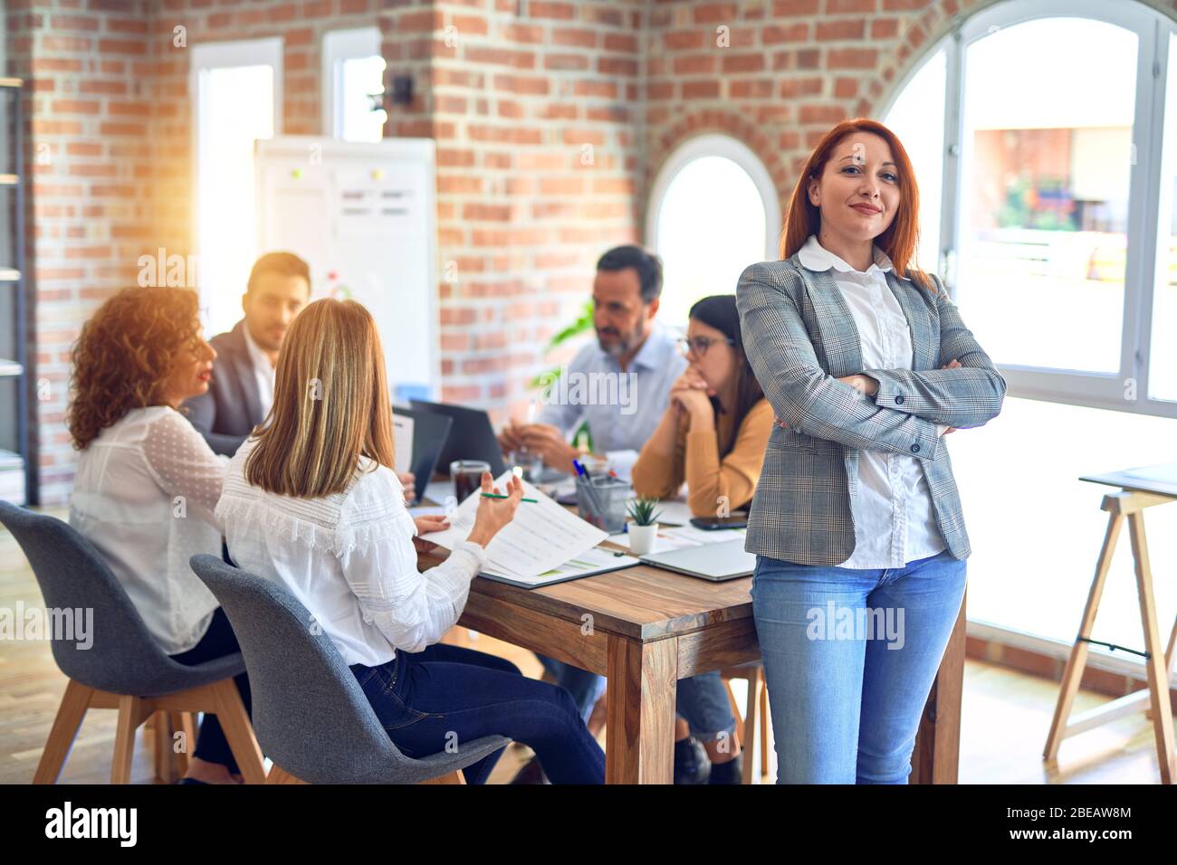 Group of business workers working together. Young beautiful ...