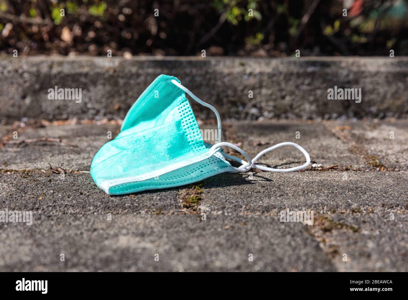 lost face mask at pavement Stock Photo - Alamy