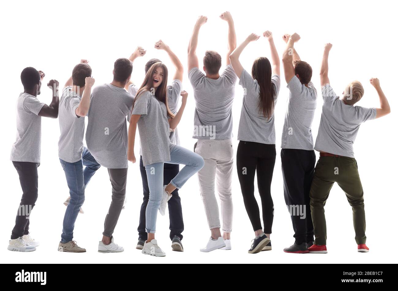rear view. a group of happy young people looking forward Stock Photo ...