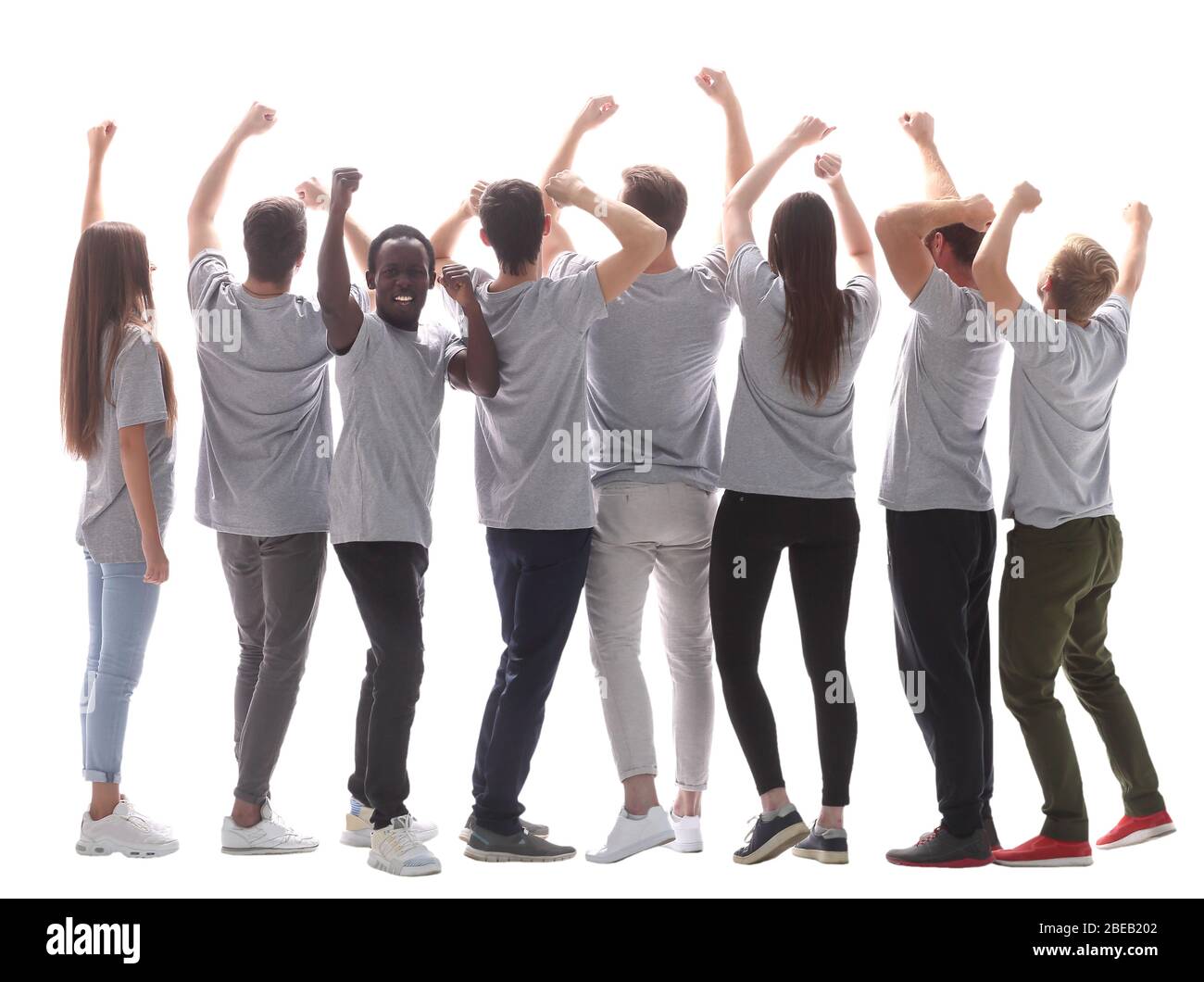 rear view. a group of happy young people looking forward Stock Photo ...