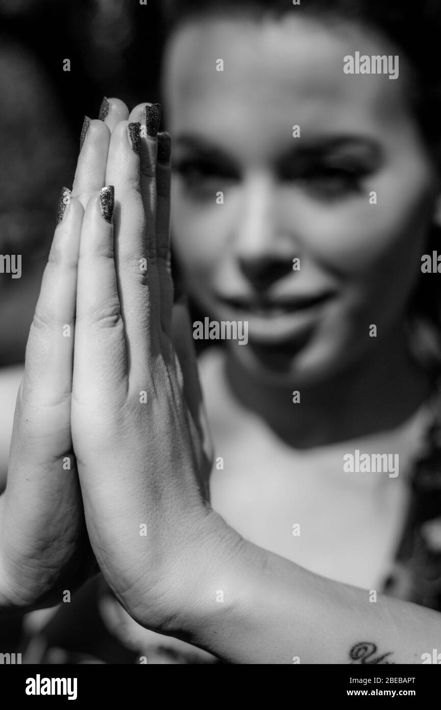 Praying Sign. Young woman with jointed hands in a prayer or meditation ...
