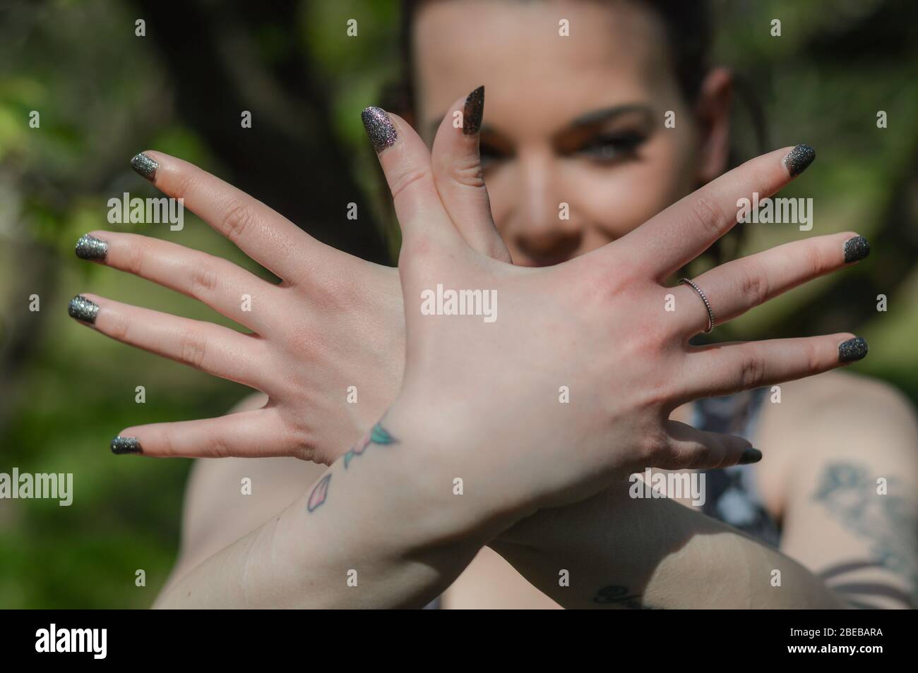 Hands like a bird Sign. Young woman crossing hands forming a flying ...