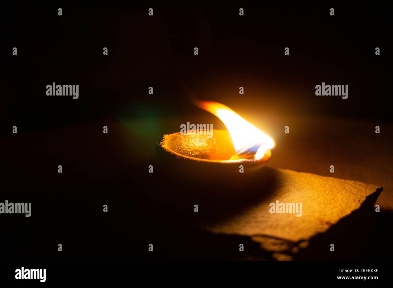 Lit diya or clay lamp on lying on the ground Stock Photo - Alamy