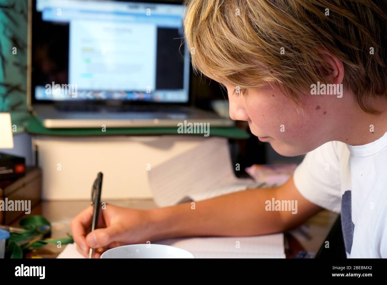 Boy doing his schoolwork hi-res stock photography and images - Alamy