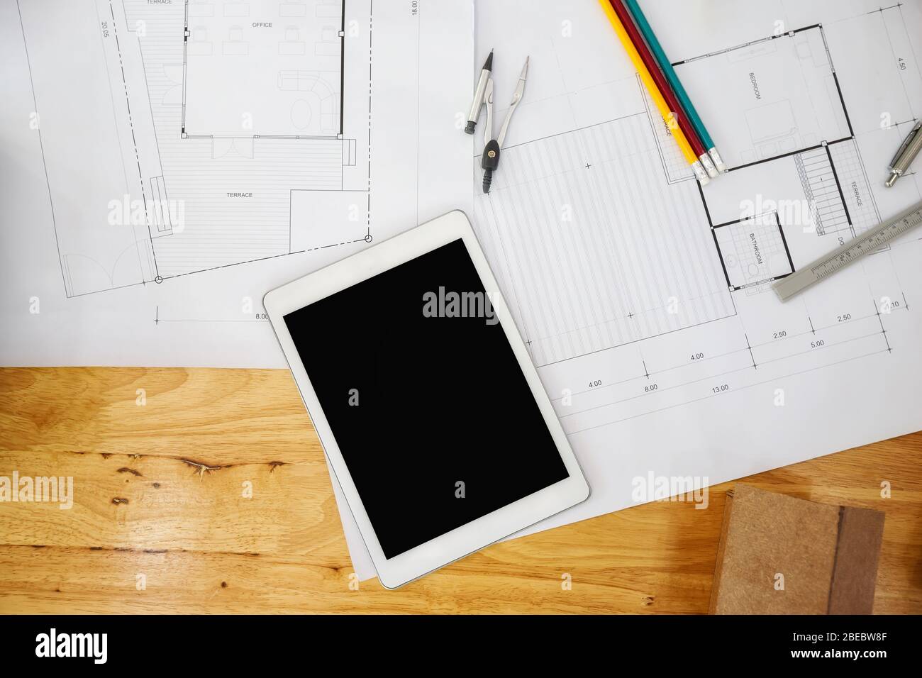 Construction blueprints with tools and tablet, top view. Tablet with ...