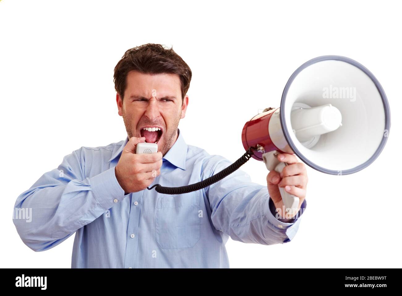 Angry man shouts into a megaphone Stock Photo - Alamy