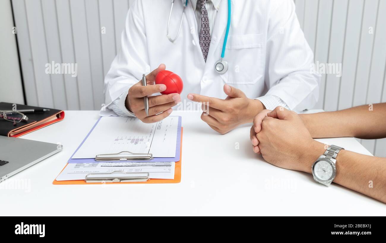 Doctor talking elderly patient heart hi-res stock photography and ...