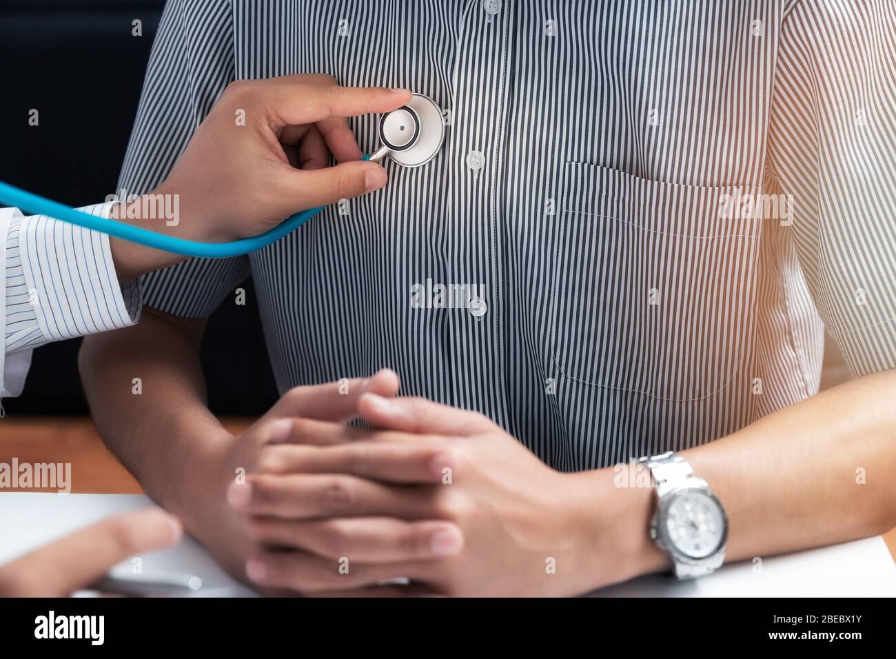 Doctor Checking Patient With Stethoscope. Doctor listening to patient ...