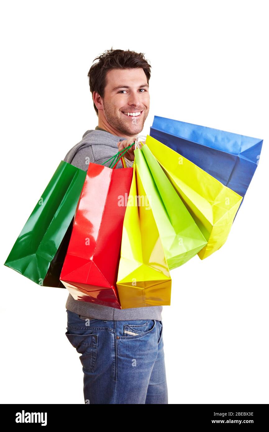 Happy customer carries a lot of colorful shopping bags Stock Photo - Alamy