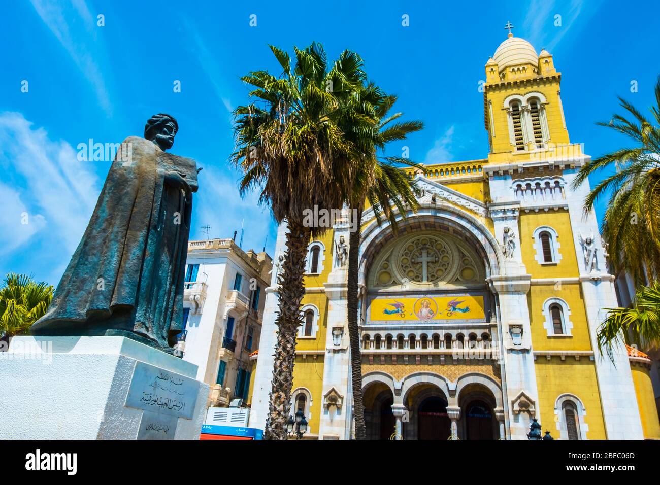 Cathedral facade and Ibn Khaldoun statue Stock Photo - Alamy