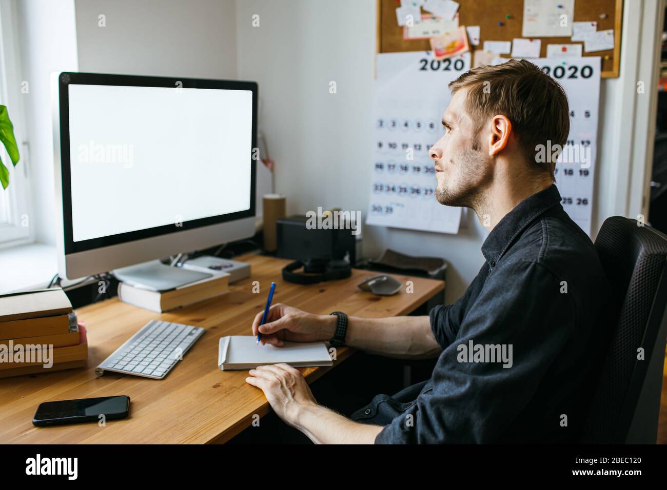 Person working on computer behind hi-res stock photography and images ...