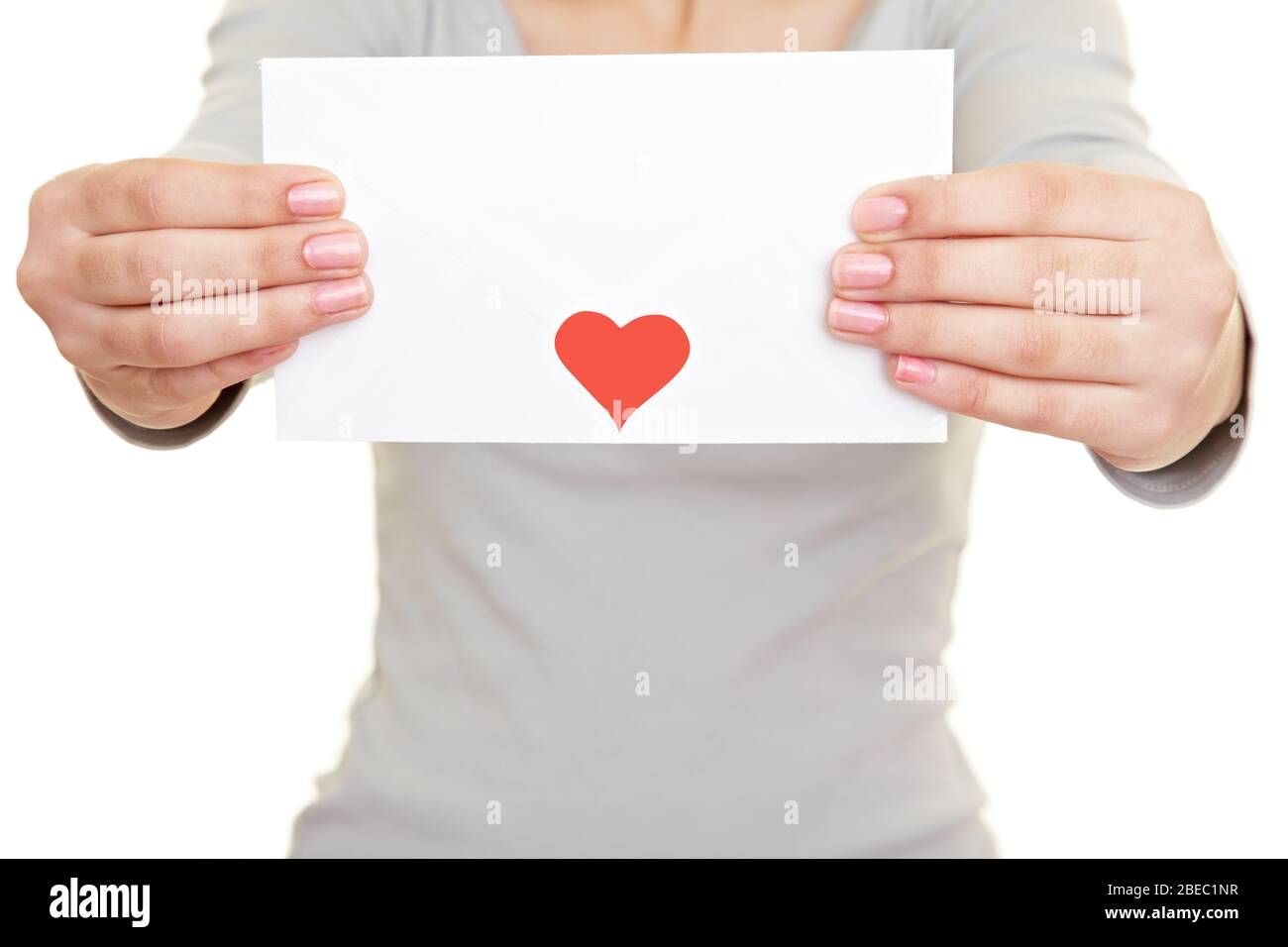Female hands hold a love letter with a red heart Stock Photo - Alamy