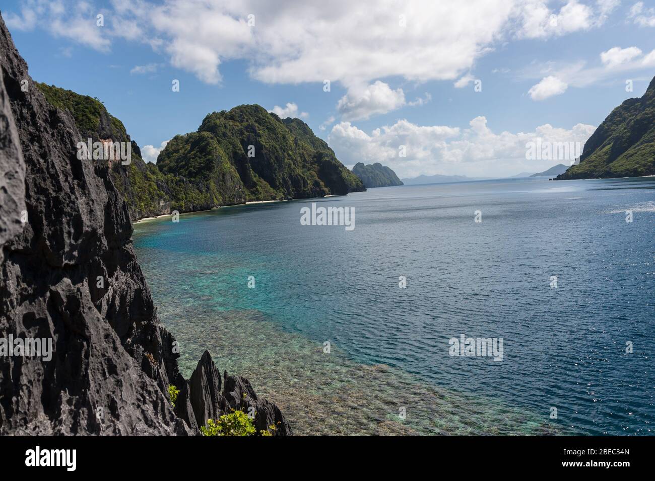 Transparent turquoise water limestone razor rocks near Coron island ...