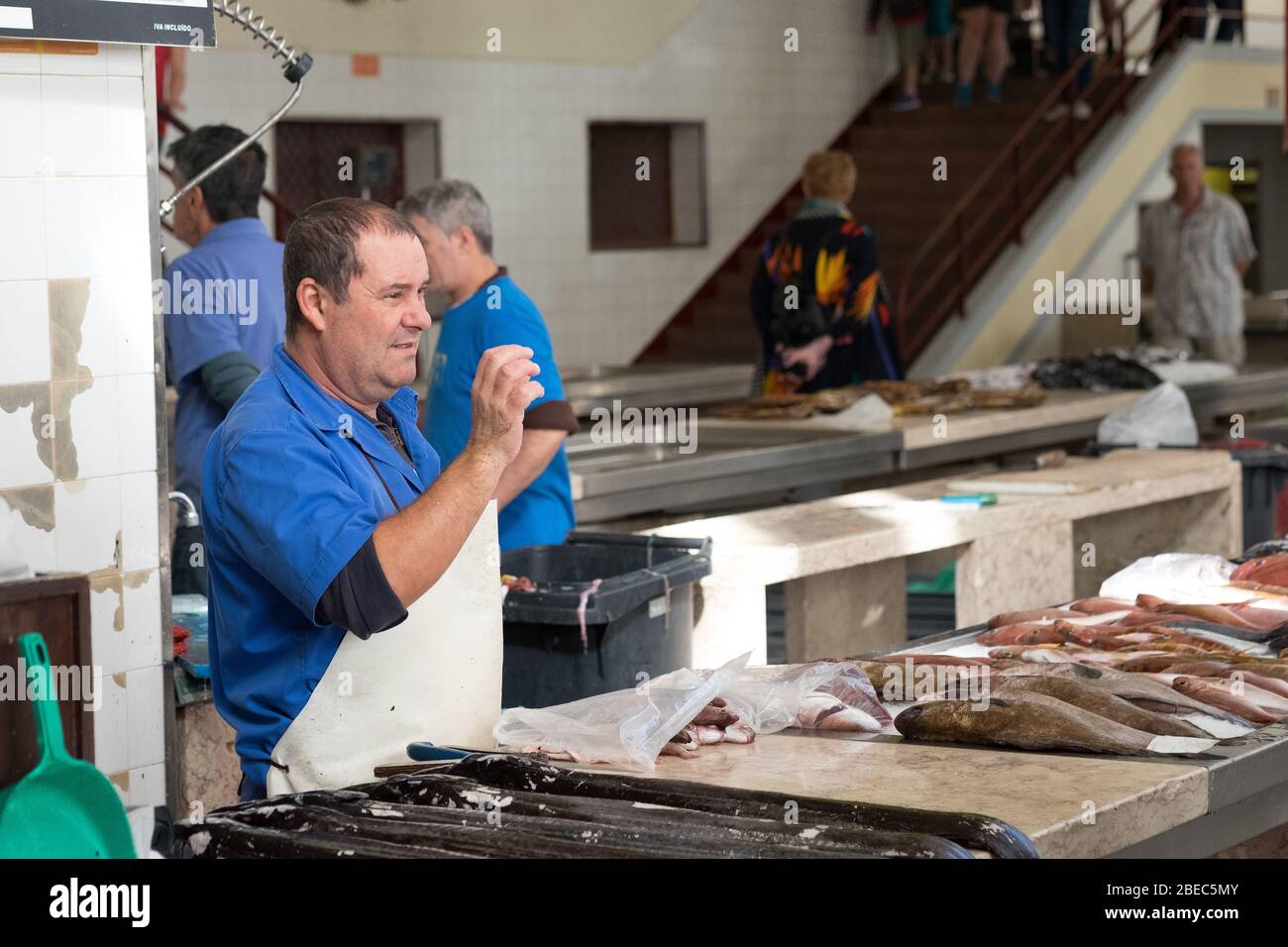 A fishmonger at the fish market at Funchal, Madeira Stock Photo - Alamy