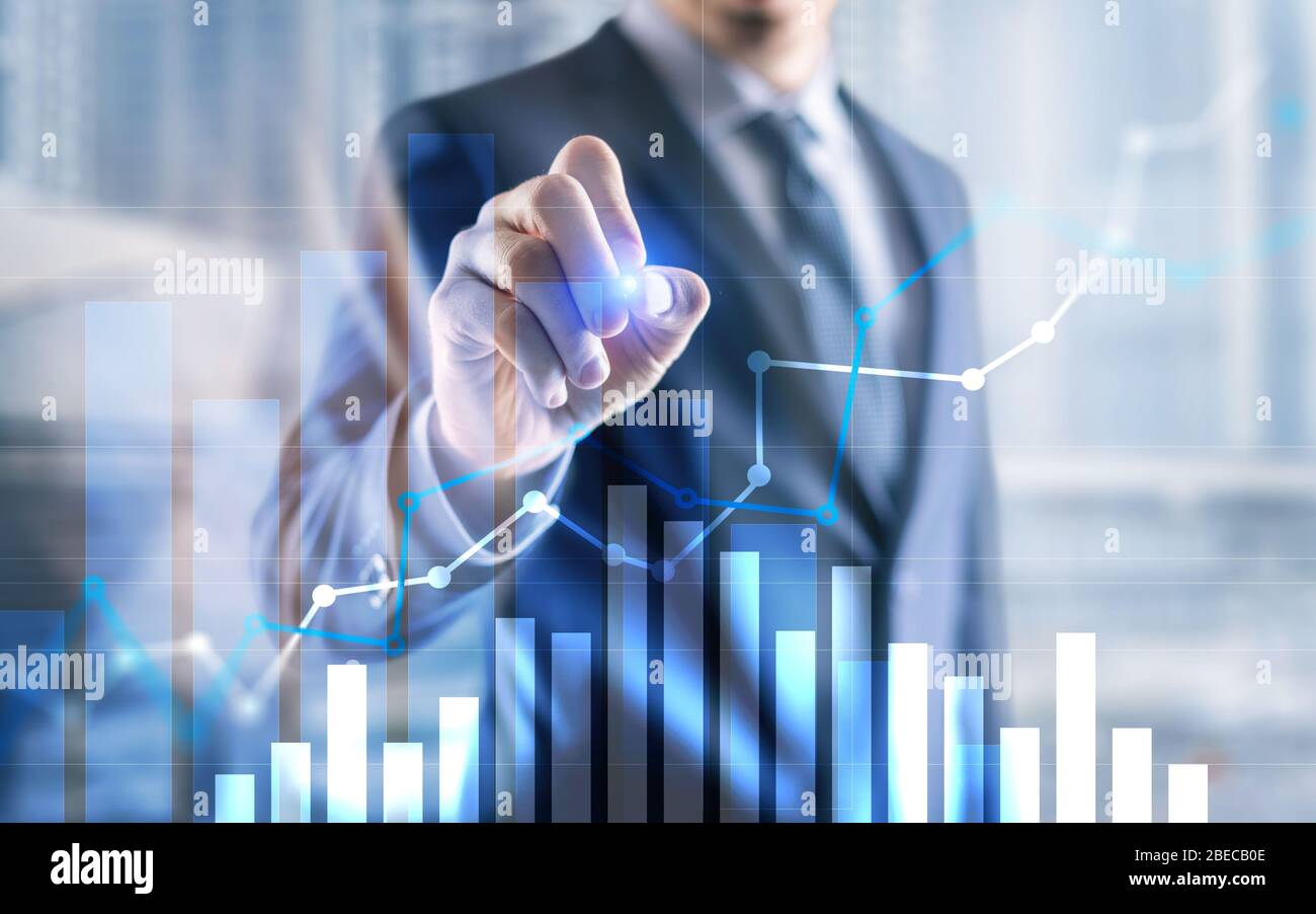 Businessman drawing graph with marker on media screen Stock Photo - Alamy