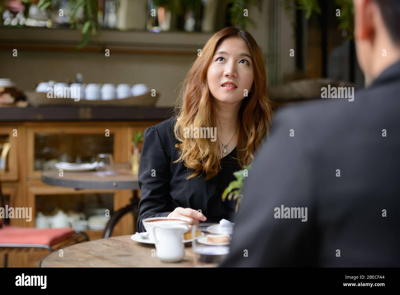 Happy young Asian business couple together at the coffee shop Stock ... Happy young Asian business couple together at the coffee shop Stock ...