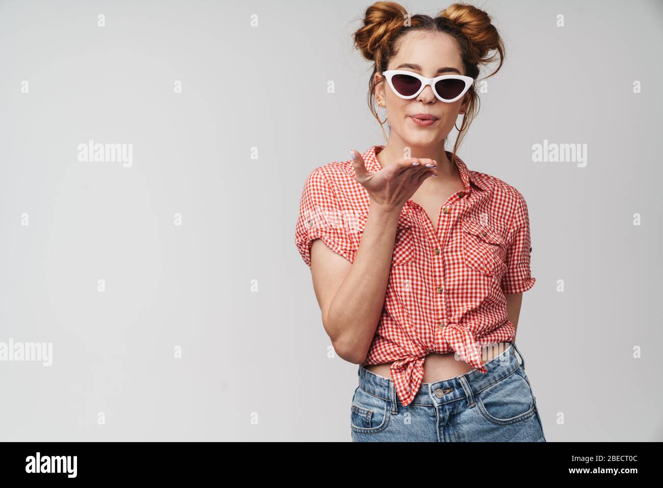 Lovely young teenage girl wearing summer clothes standing isolated over ...