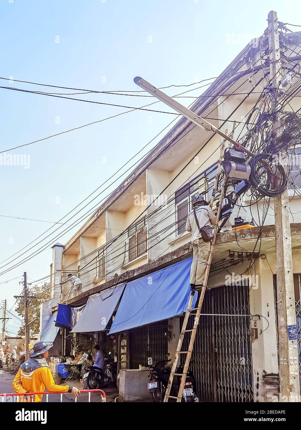 Lineman climbing ladder power pole hi-res stock photography and images ...