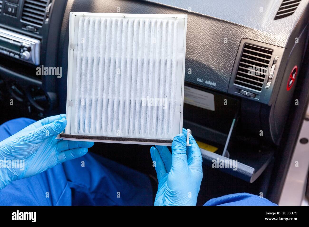 Replacing cabin pollen air filter for a car Stock Photo - Alamy