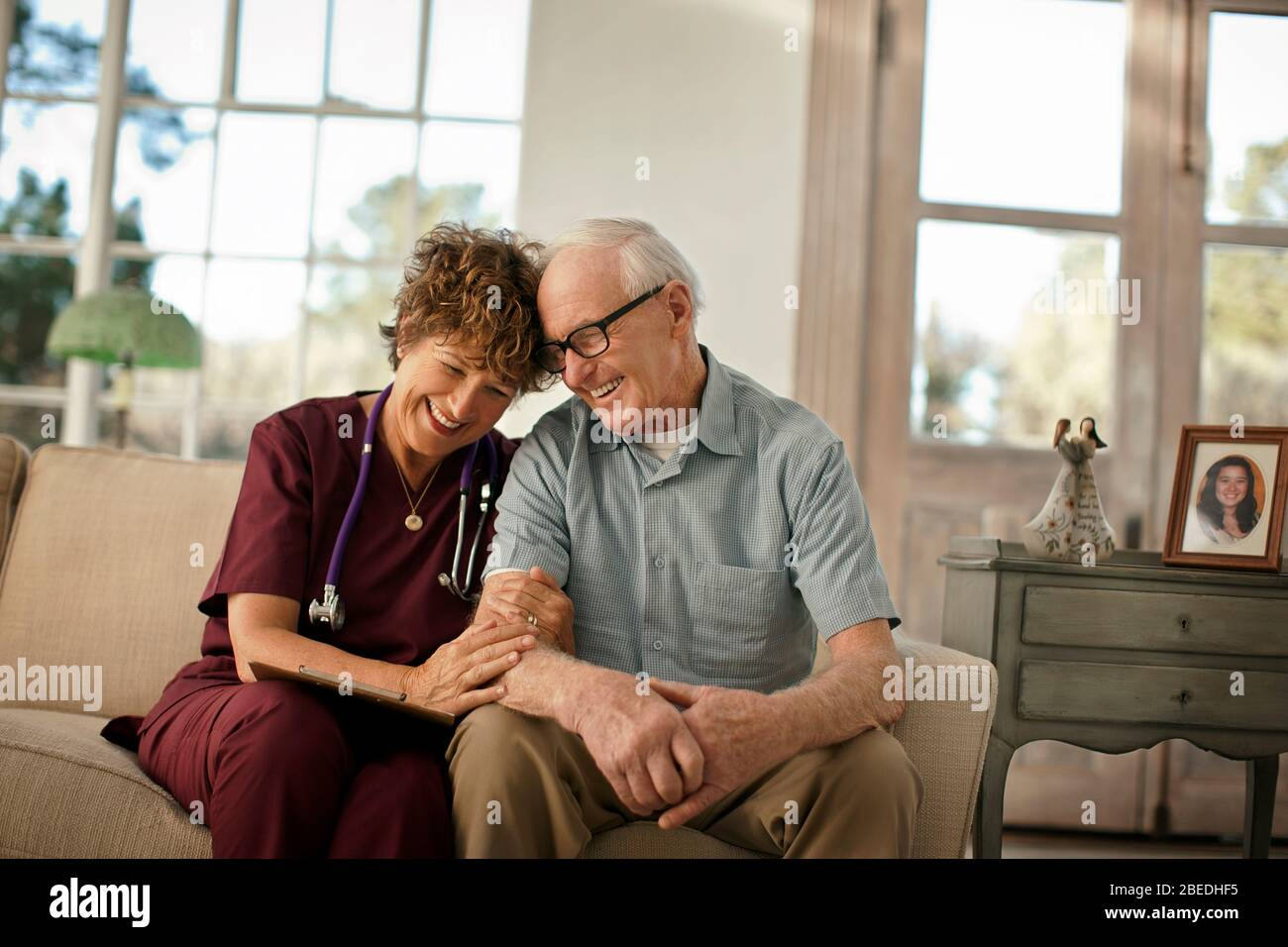 Two nurses elderly patient hi-res stock photography and images - Alamy