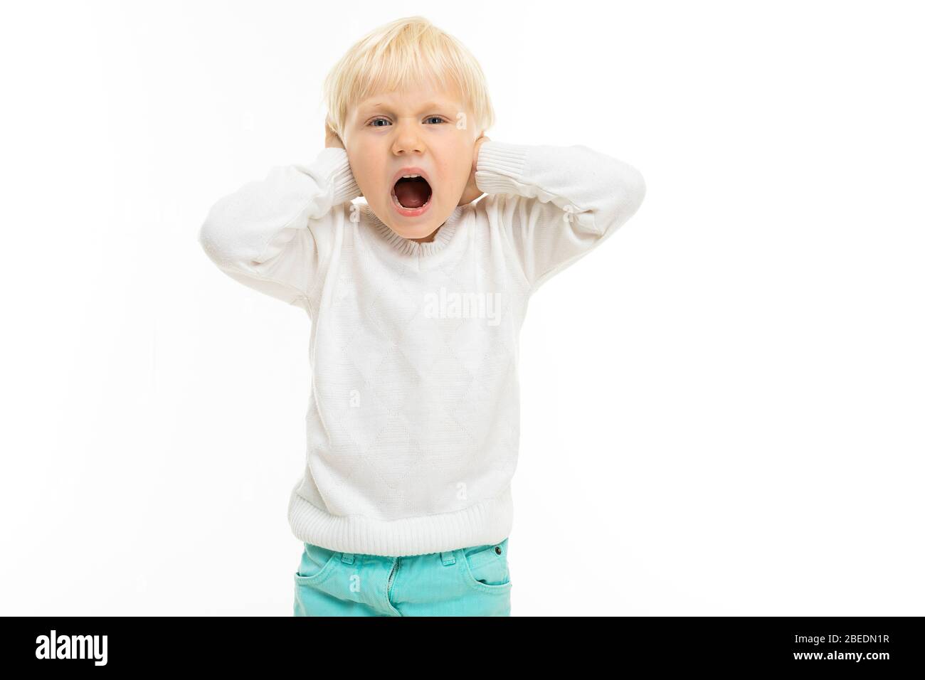Little boy with short blonde hair, blue eyes screams, picture isolated ...