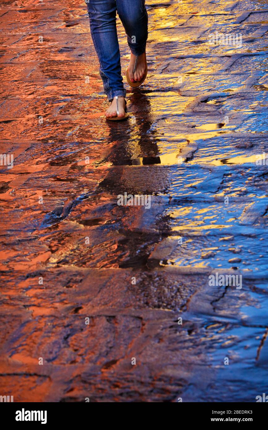 A twenty year old female walks down a San Miguel de Allende street ...