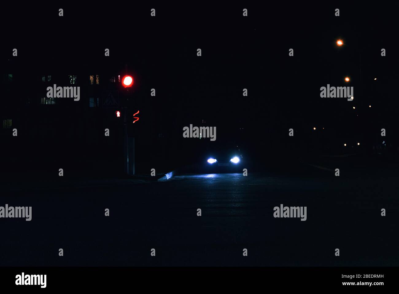 Red light at the intersection at night Stock Photo - Alamy