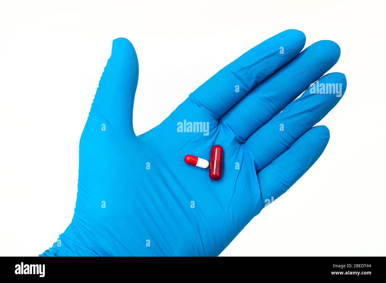 Hand doctor giving medicine hi-res stock photography and images - Alamy