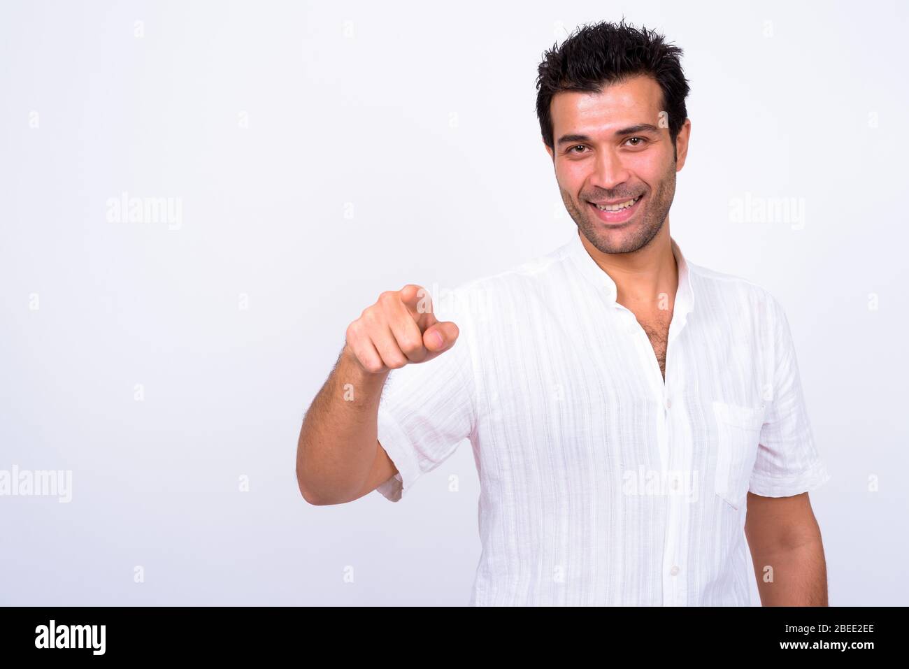 Portrait of happy handsome Turkish man pointing at camera Stock Photo ...