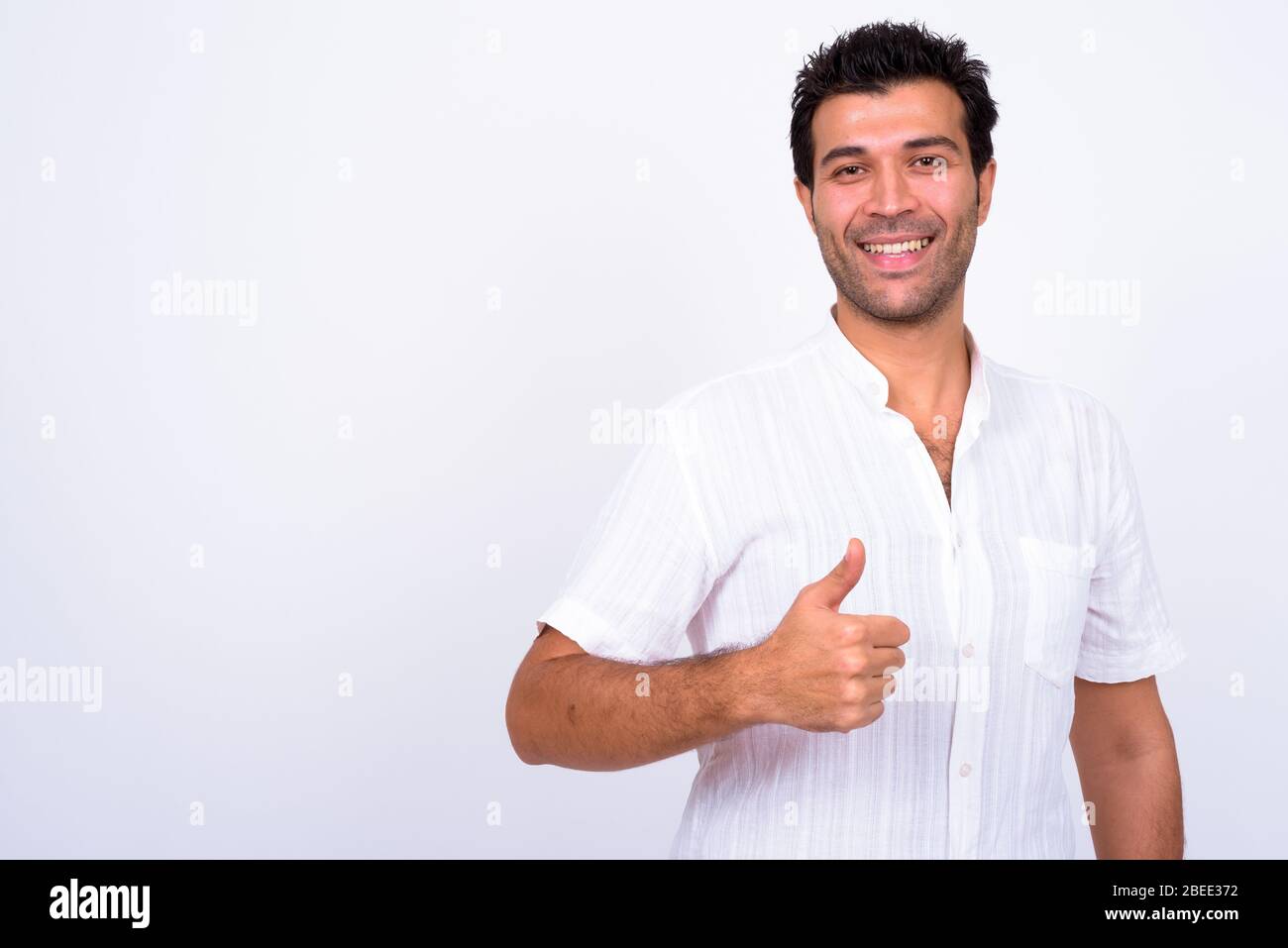 Portrait of happy handsome Turkish man giving thumbs up Stock Photo - Alamy